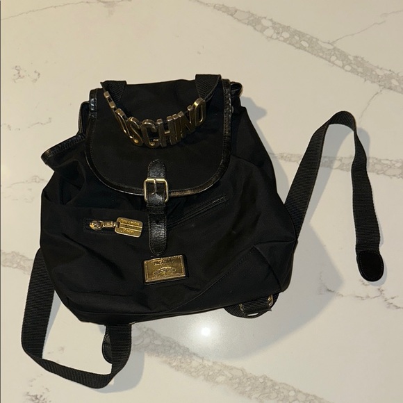 Moschino | Bags | Vintage Moschino Black Backpack With Gold Chain ...